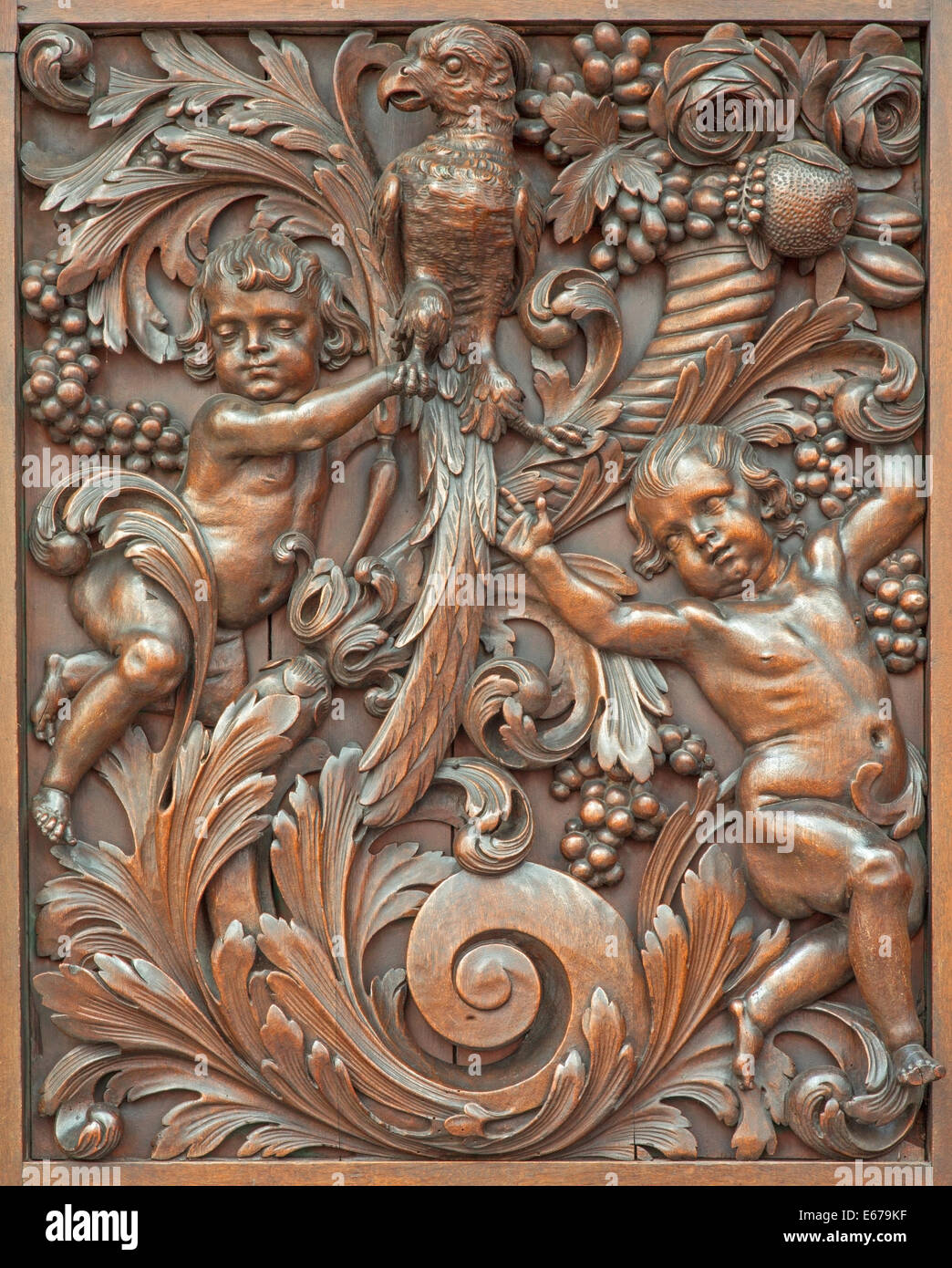 BRUGES, BELGIUM - JUNE 13, 2014: The carved symbolic relief of angels ...