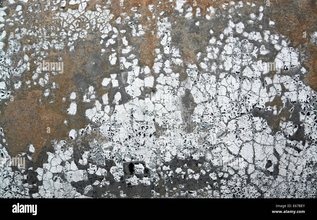 old rundown surface with cracked paint remains on rusty ground Stock ...