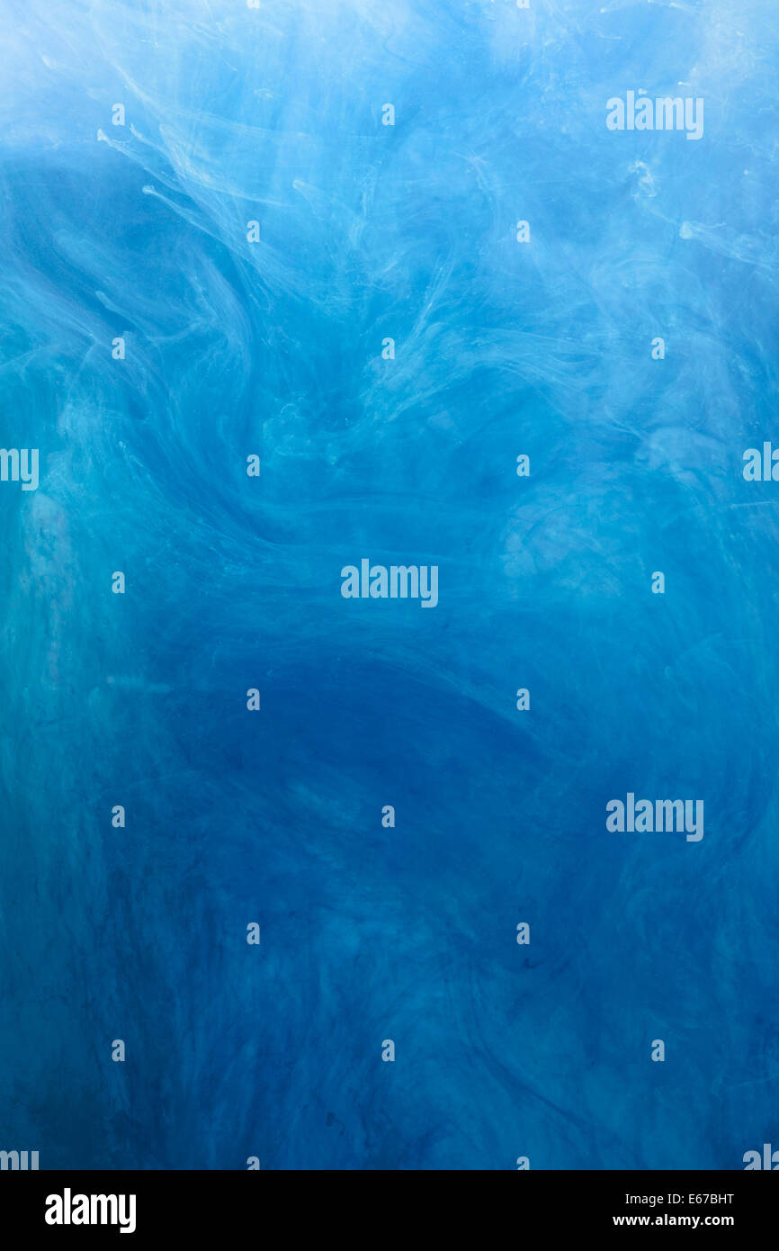 abstract photography showing floating color strings in blue underwater ...