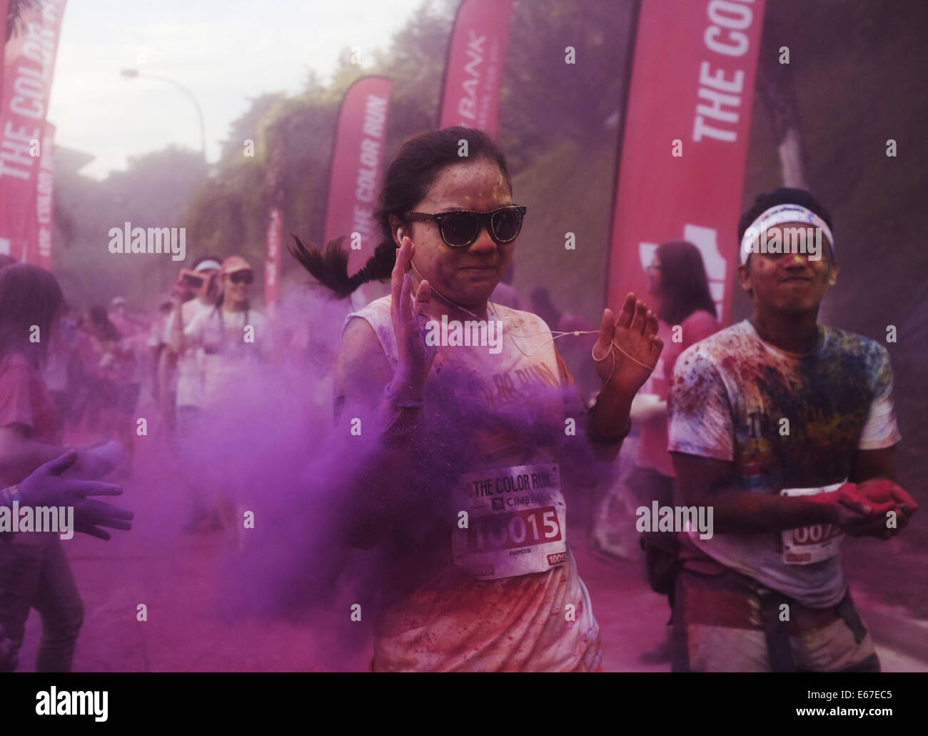 Kuala Lumpur, Malaysia. 17th Aug, 2014. A participant reacts as she run ...