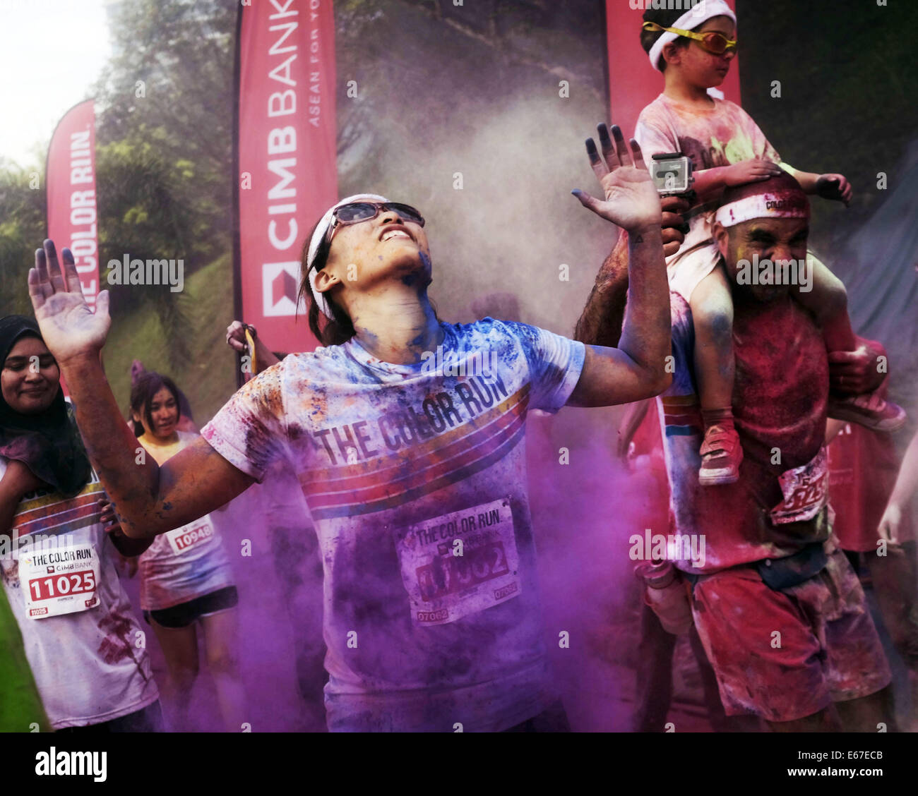 Kuala Lumpur, Malaysia. 17th Aug, 2014. A participant reacts as she run ...