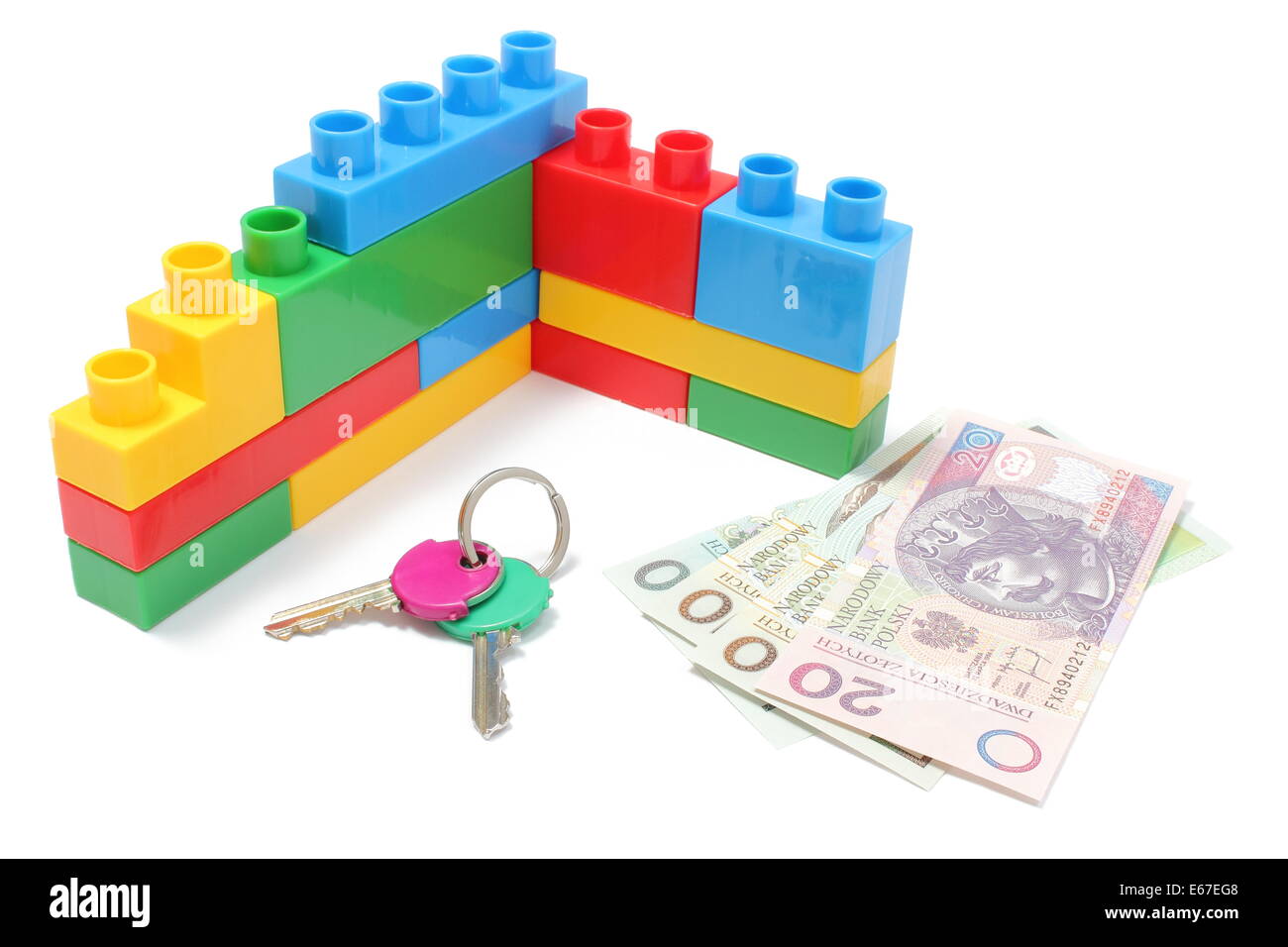 Closeup of home keys, wall of plastic colorful building blocks and ...