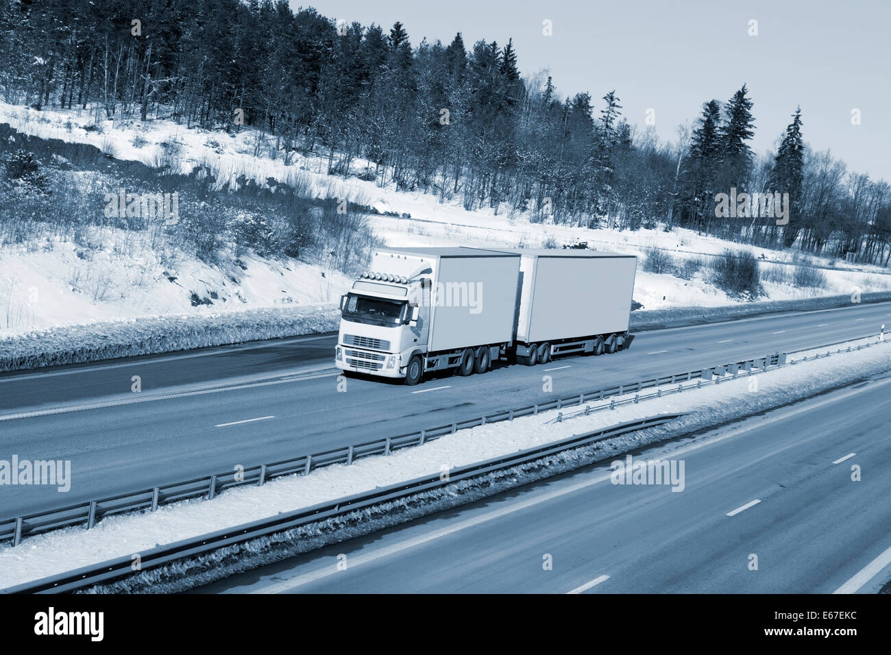 truck driving in snowy winter surroundings Stock Photo - Alamy