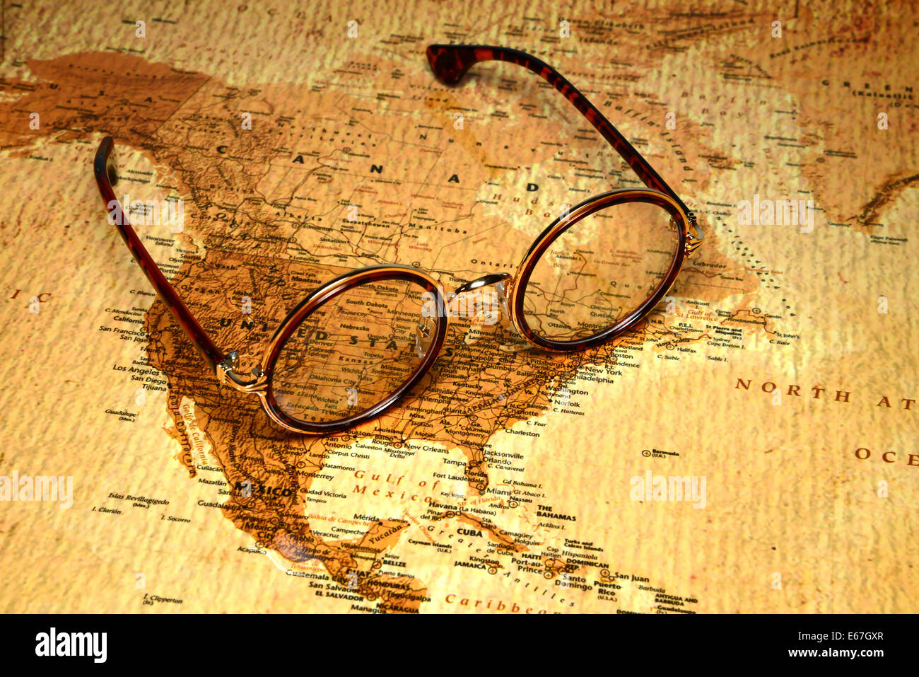 Glasses on a map of a world - United States Stock Photo - Alamy