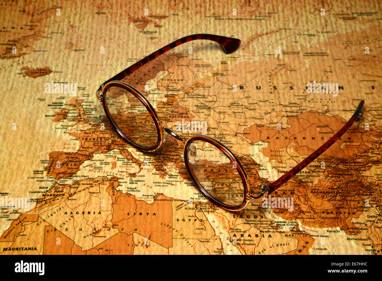 Glasses on a map of a world Stock Photo - Alamy