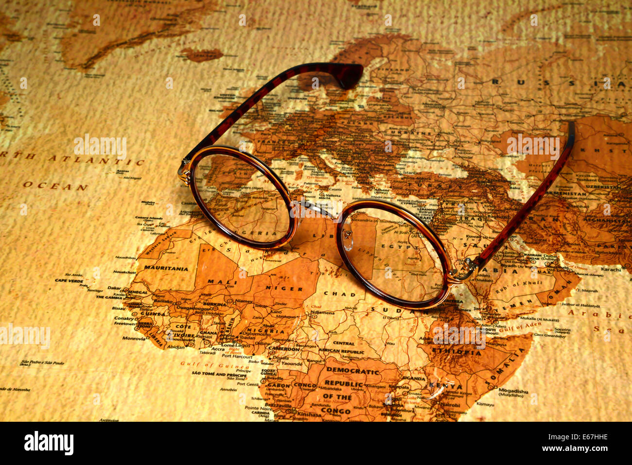 Glasses on a map of a world - Egypt Stock Photo - Alamy