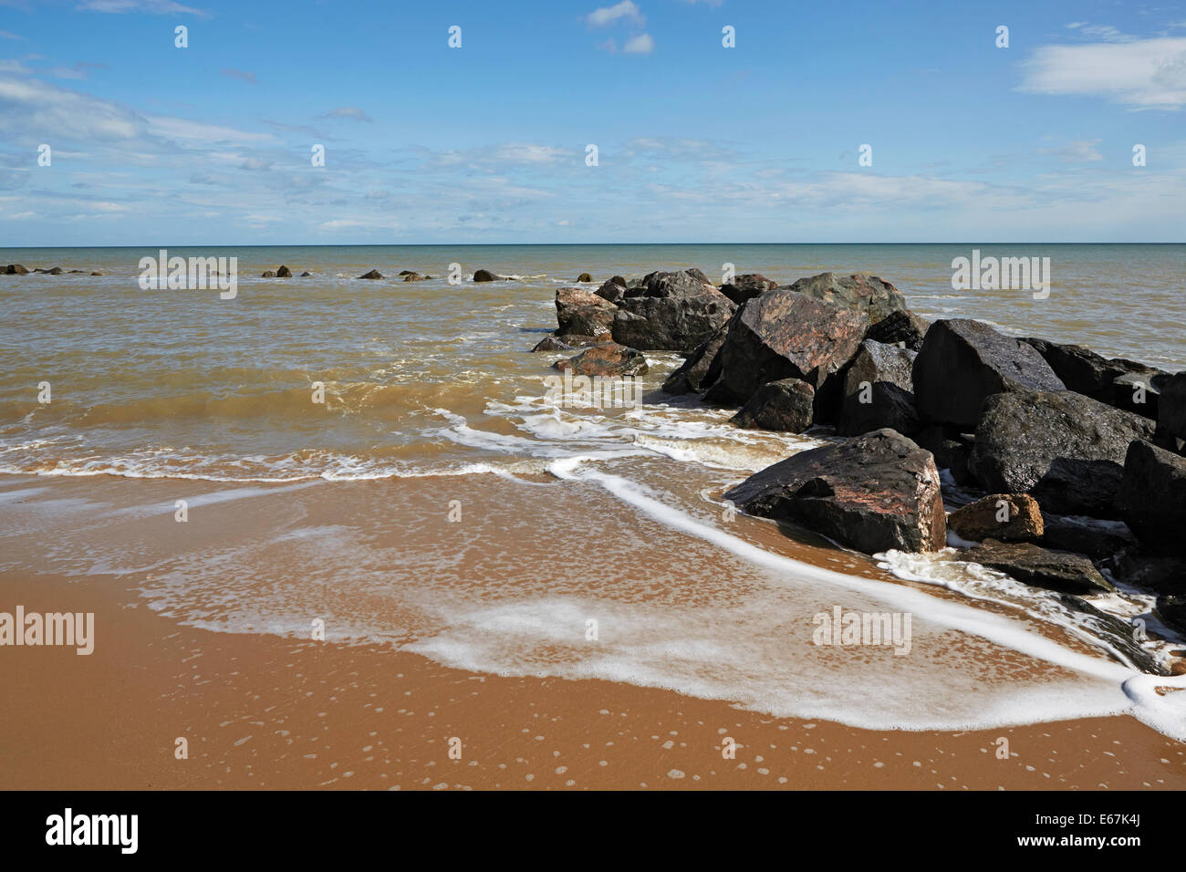 Happisburgh beach North Norfolk showing boulders placed to delay ...