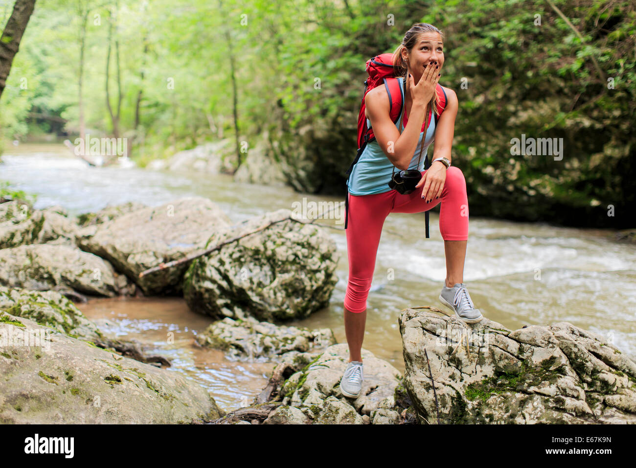 Young woman hiking in the forest Stock Photo - Alamy