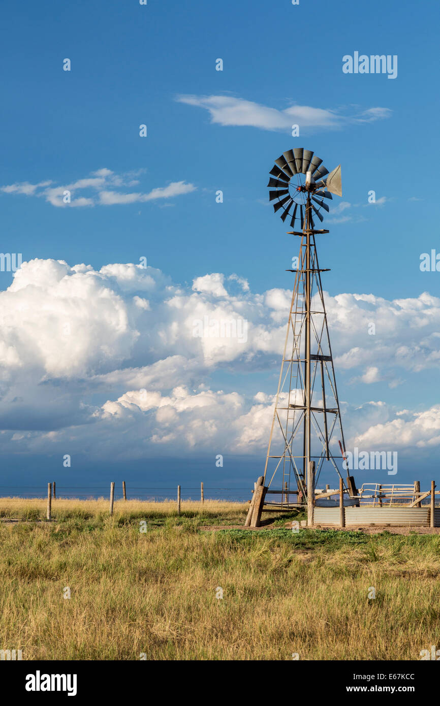 windmill with a pump and cattle water tank in shortgrass prairie ...