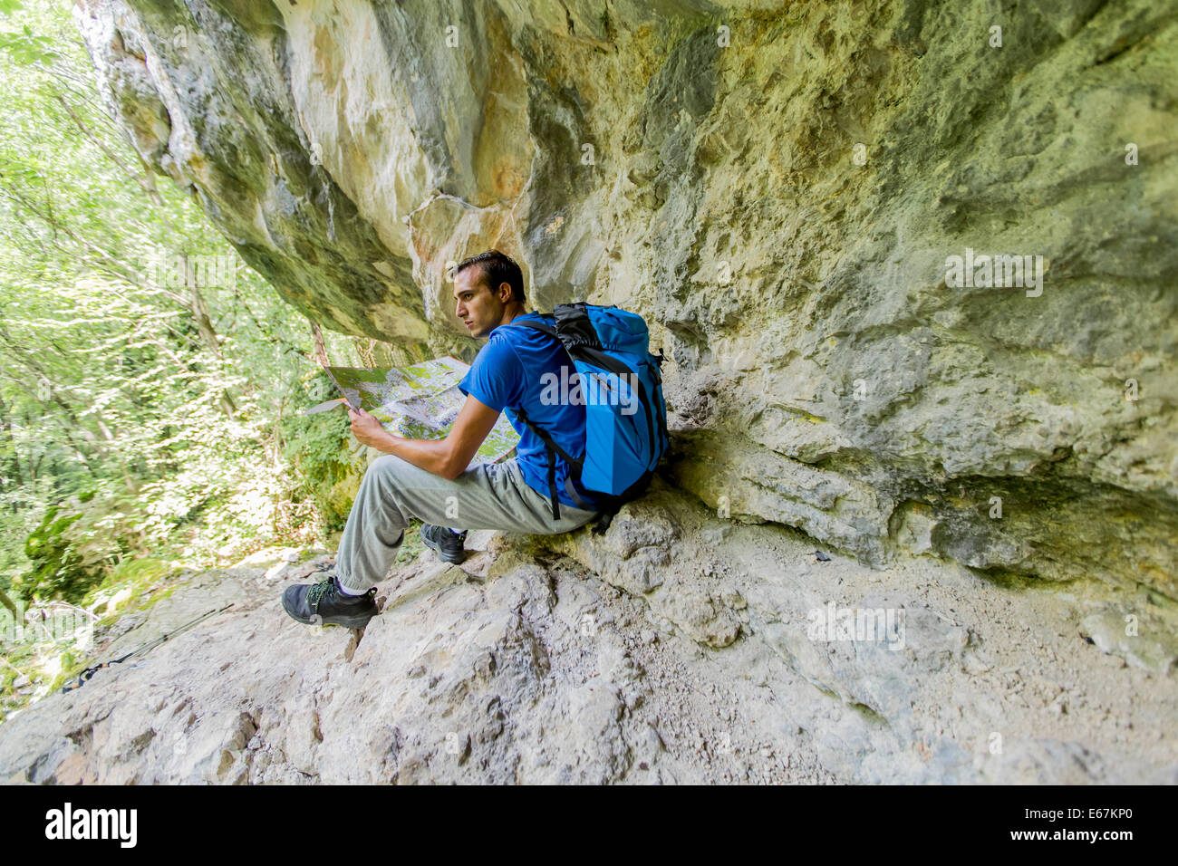 Young man hiking Stock Photo - Alamy