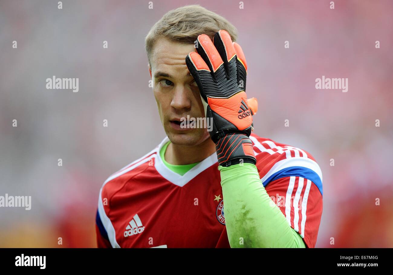 Munich's goal keeper Manuel Neuer touches his face during the DFB Cup ...