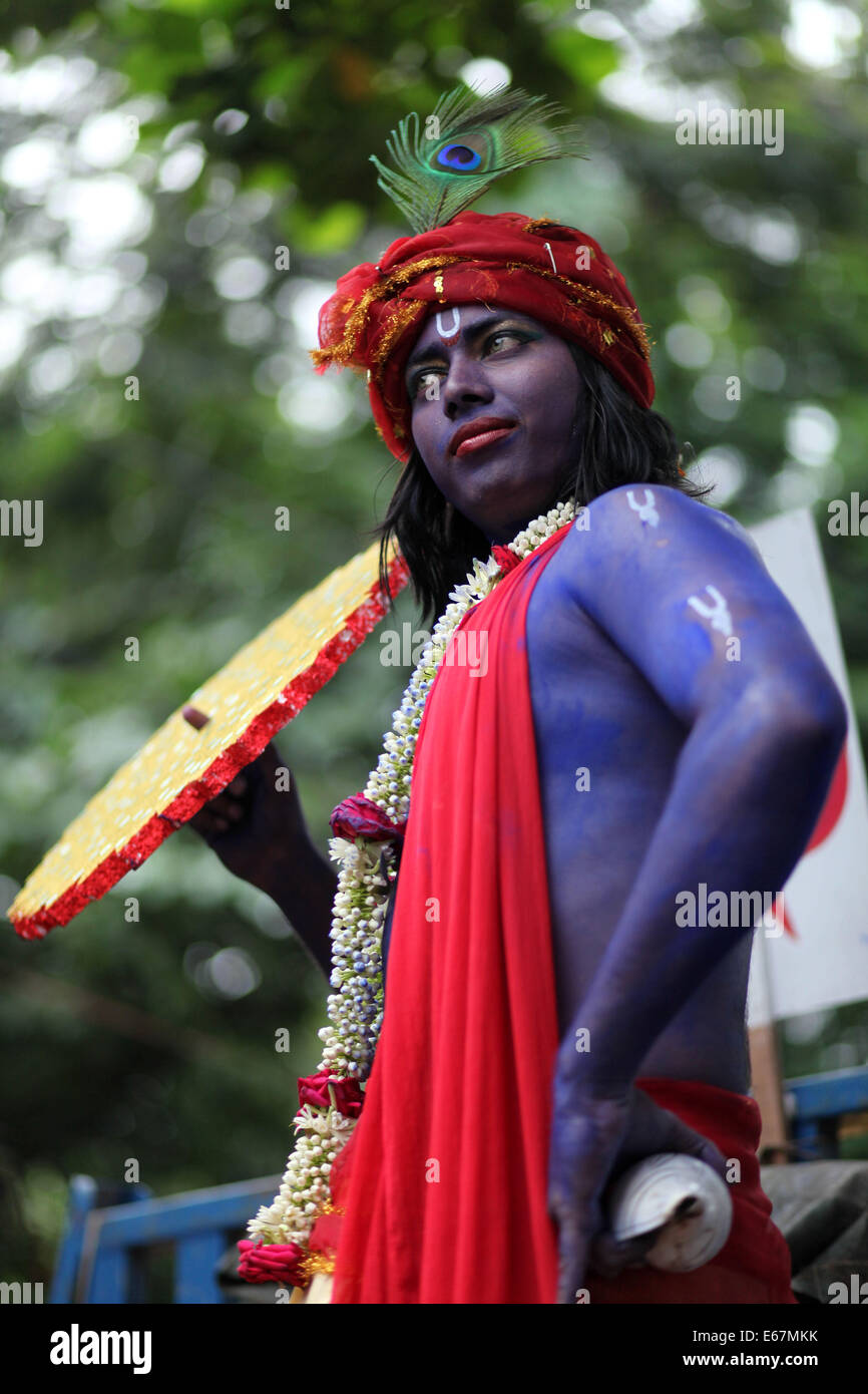A Bangladeshi Hindu boy dressed like Lord Sri Krishna take part in the ...
