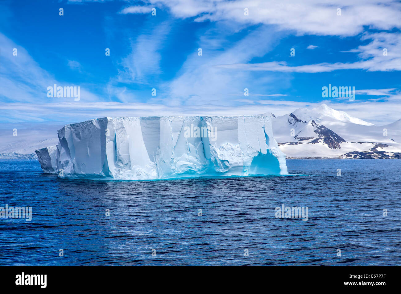 Antarctic iceberg floating in the ocean with beautiful background ...