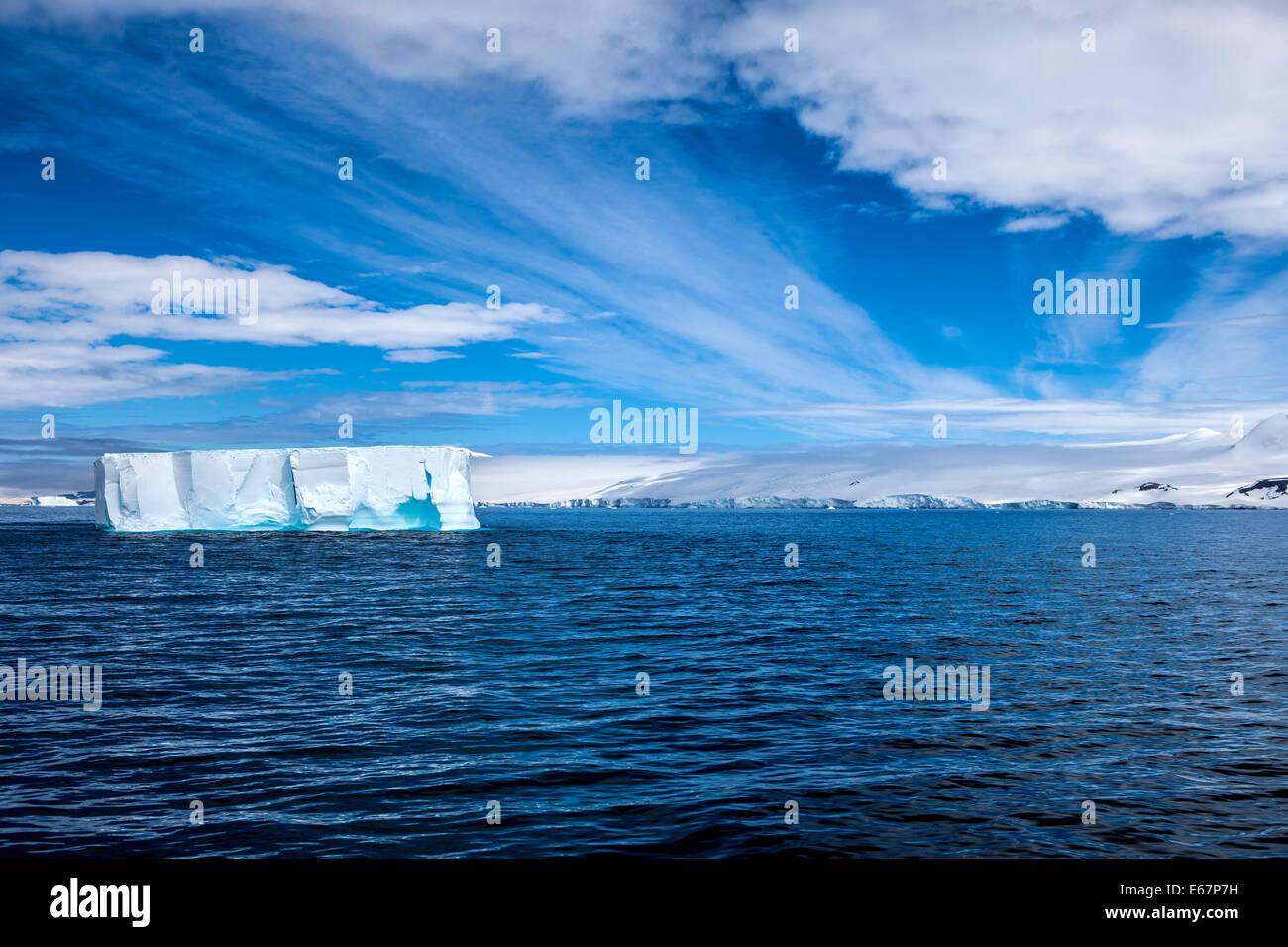 Antarctic iceberg floating in the ocean with beautiful background ...