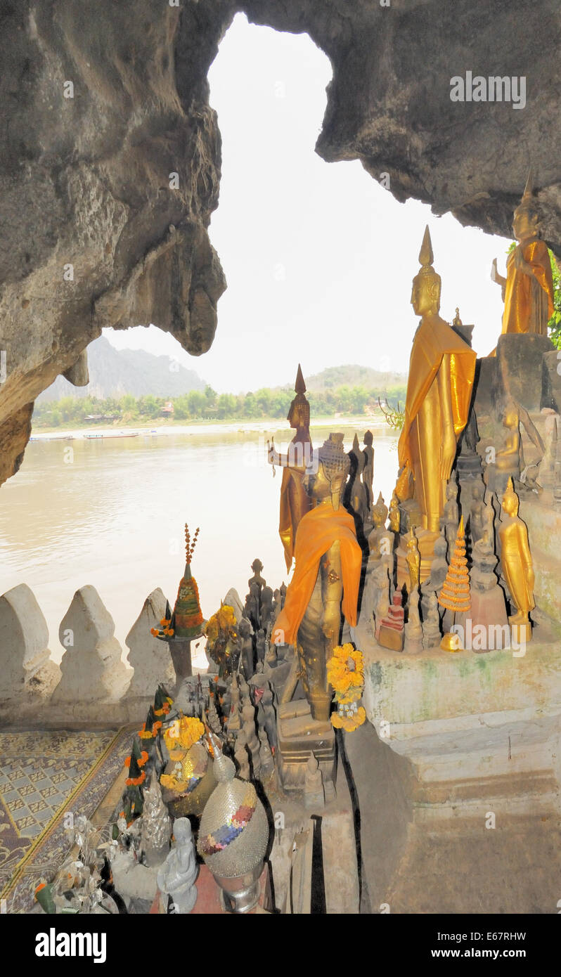 Buddhist statues in Pak Ou Buddha Cave, Luang Prabang, Laos Stock Photo ...