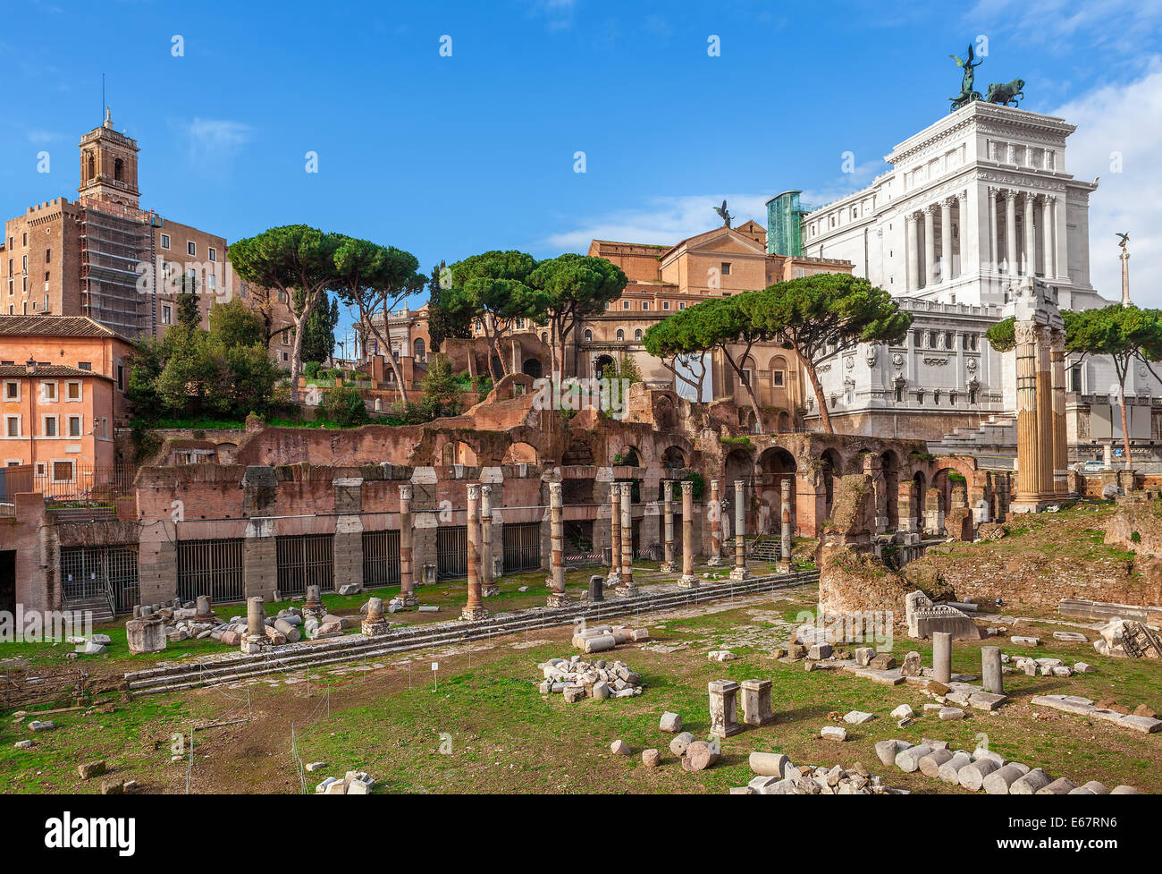 Ancient ruins of old roman forum in and Victor Emmanuel monument in ...