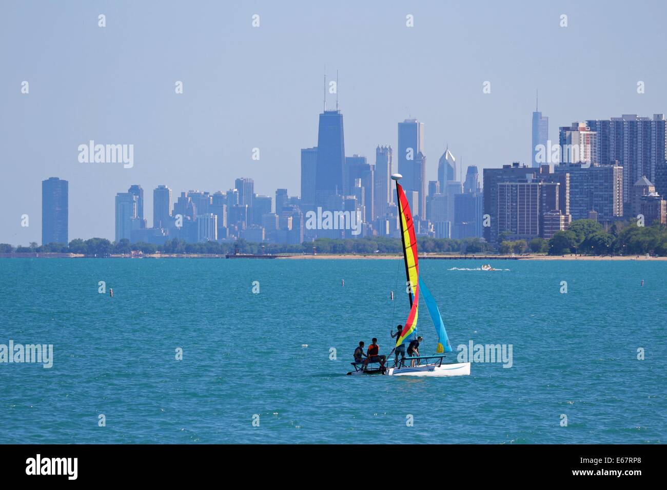 Hobie Cat with colorful sail in Lake Michigan with downtown Chicago in ...