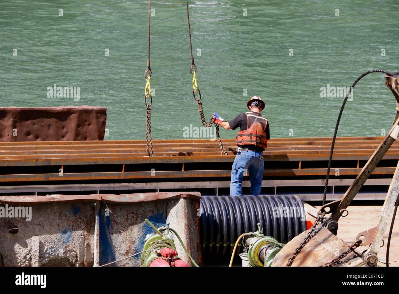 Construction worker on barge, Chicago River Stock Photo - Alamy