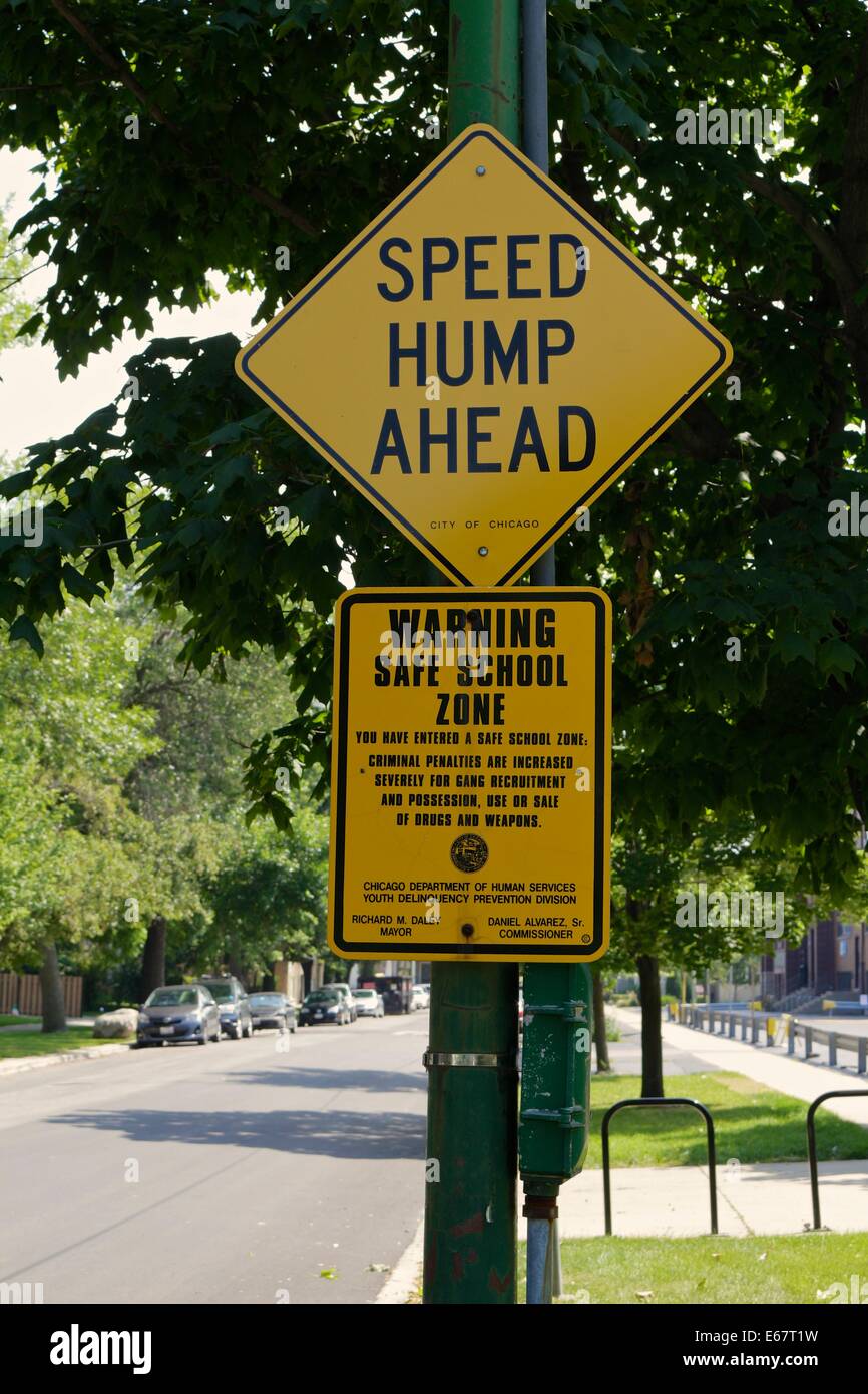 Speed hump ahead and safe school zone warning sign, Chicago, Illinois ...