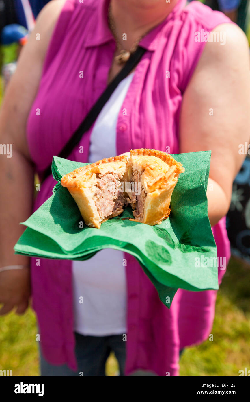 Woman eating pork pie hi-res stock photography and images - Alamy
