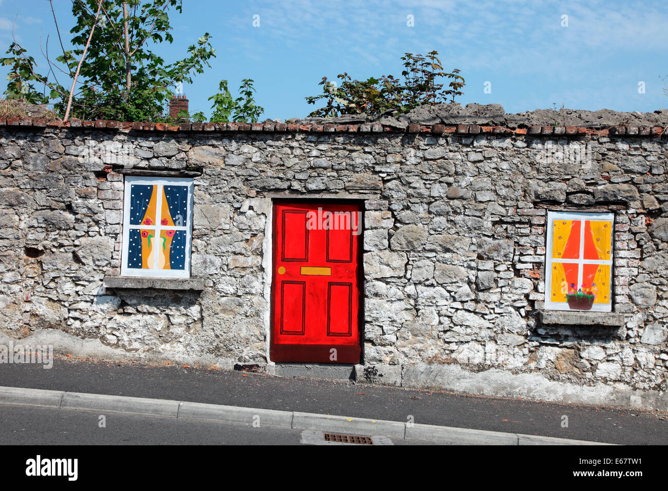 A ruined Irish cottage dressed with faux windows and door Stock Photo ...