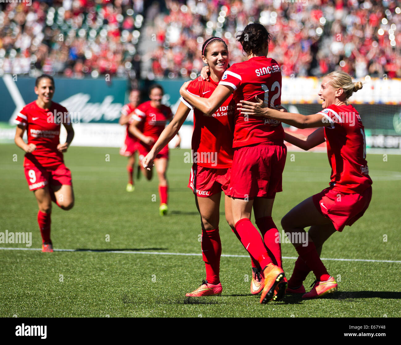 Portland, Oregon, USA. 17th Aug, 2014. ALEX MORGAN (13) celebrates with ...