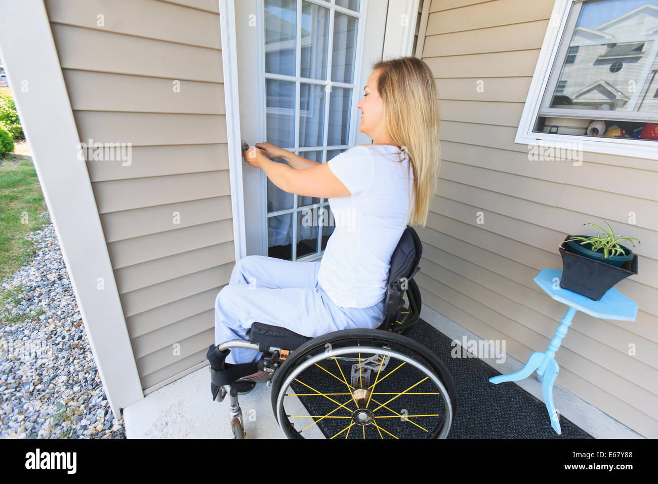 Woman locking front door hi-res stock photography and images - Alamy Woman locking front door hi-res stock photography and images - Alamy