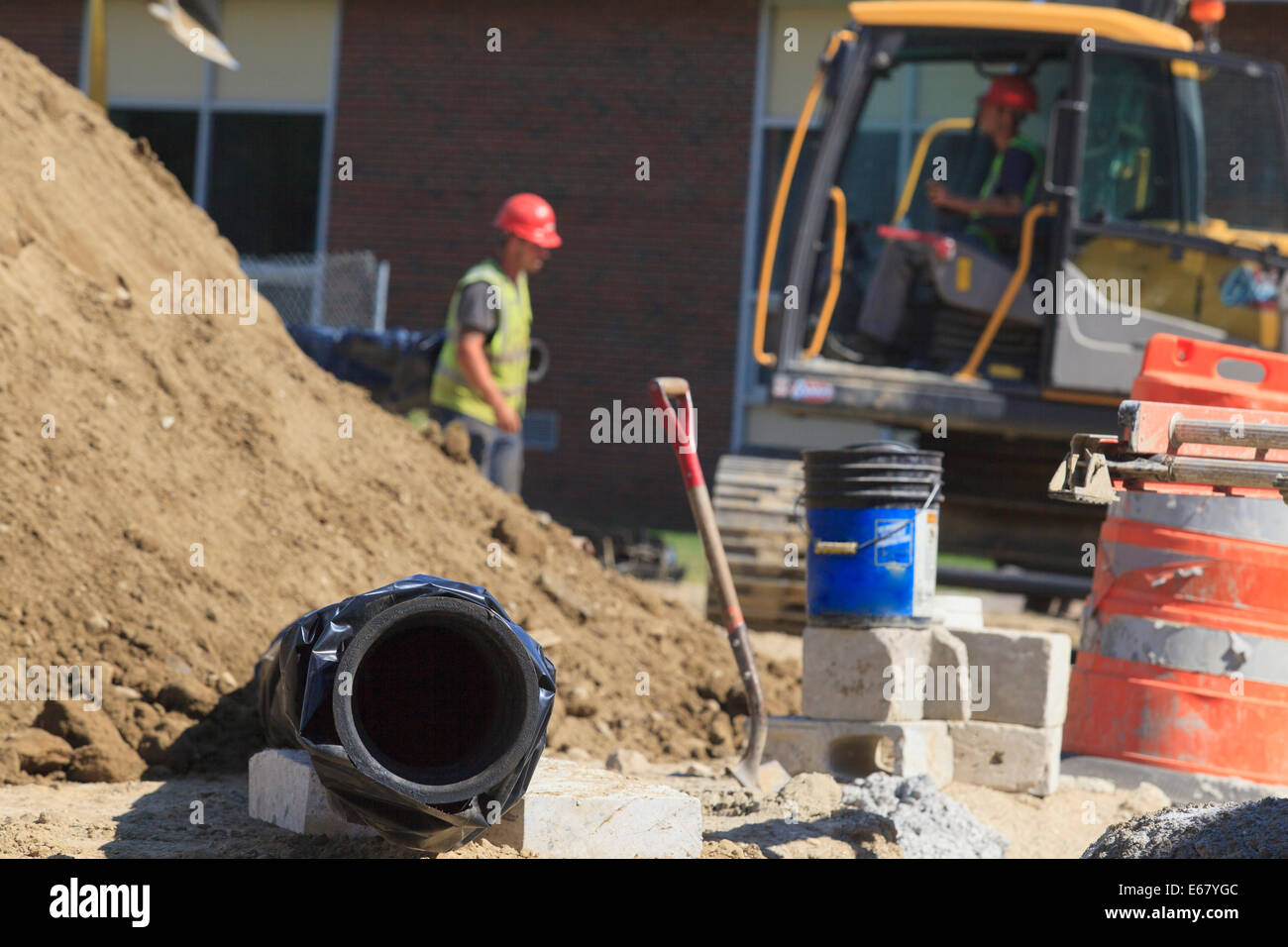 Corrosion protection sleeve over cast iron water pipe at construction ...