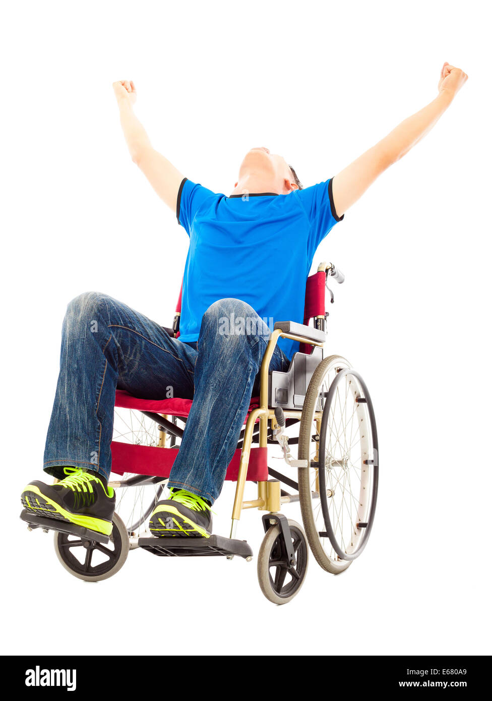 excited young man sitting on a wheelchair and raising hands Stock Photo ...