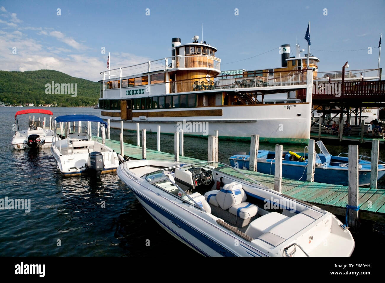 Boats docked in Lake George, including the passenger tourist boat ...