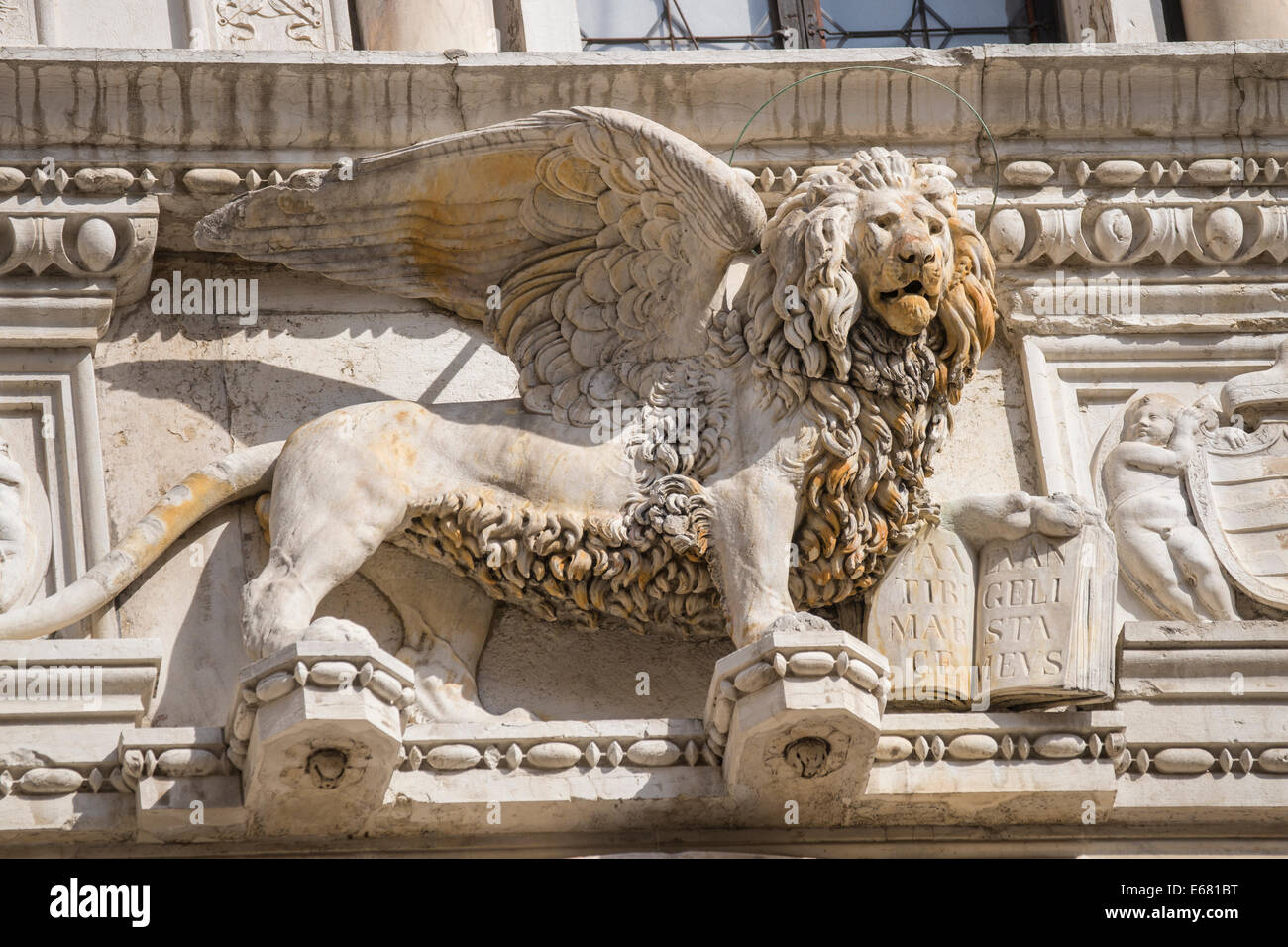 Relief sculpture of St. Mark's Lion or the Winged Lion of Venice above ...