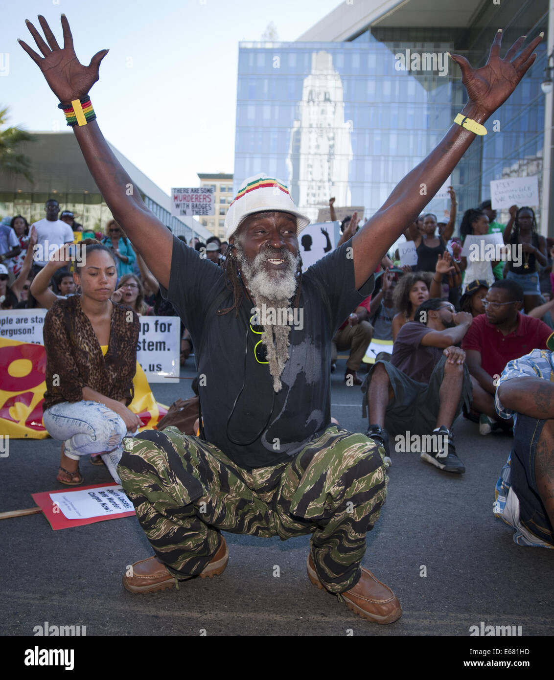 Los Angeles, California, USA. 17th Aug, 2014. A protest leader raises ...
