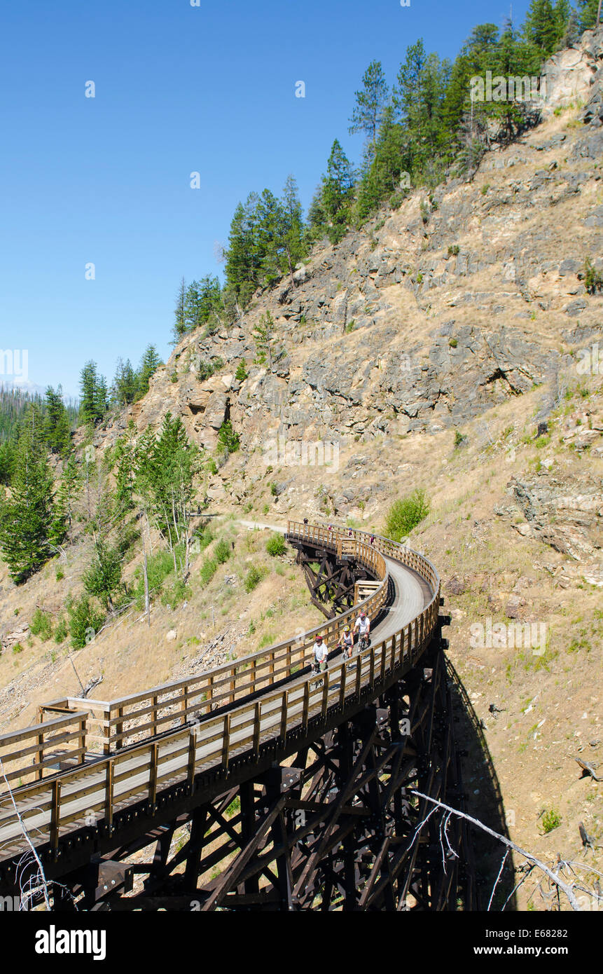 Mountain biking cycling riding old wooden railway trestles bridge trail ...