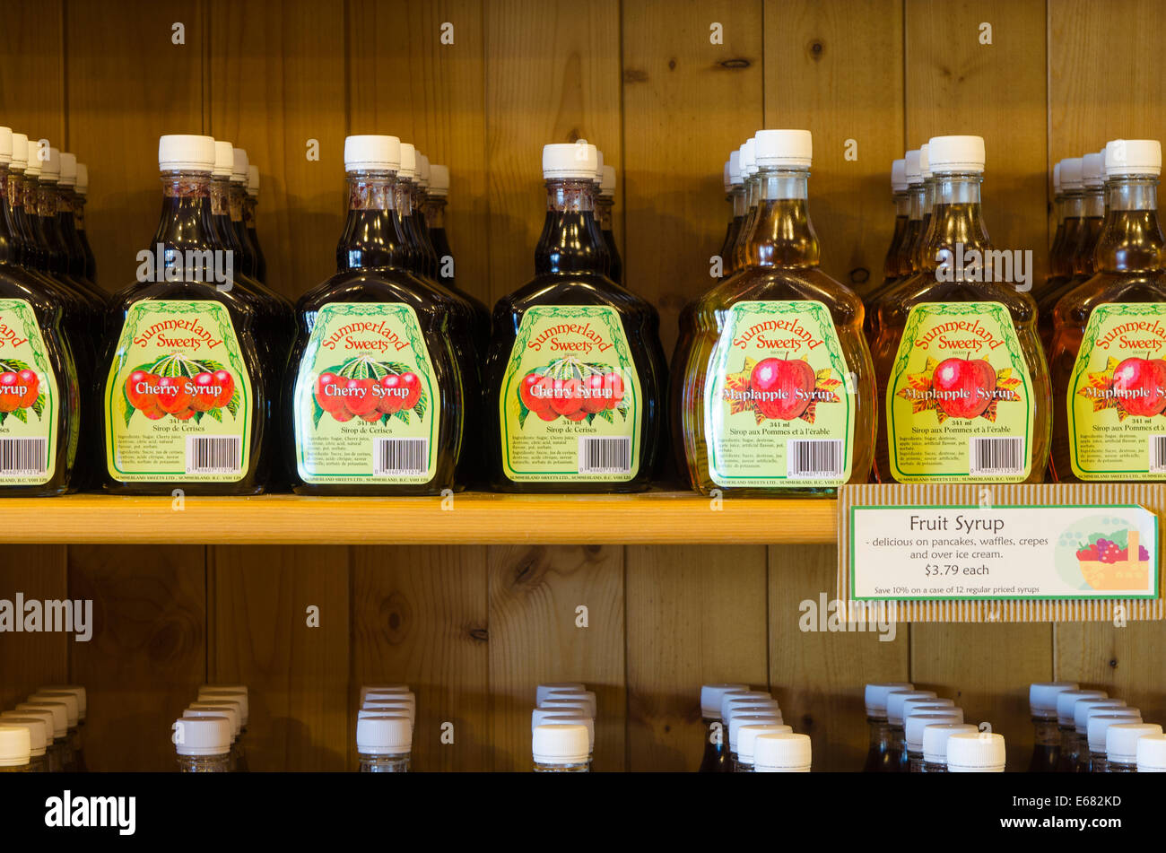 Glass bottles of fruit syrup preserves at Summerland Sweets and ...
