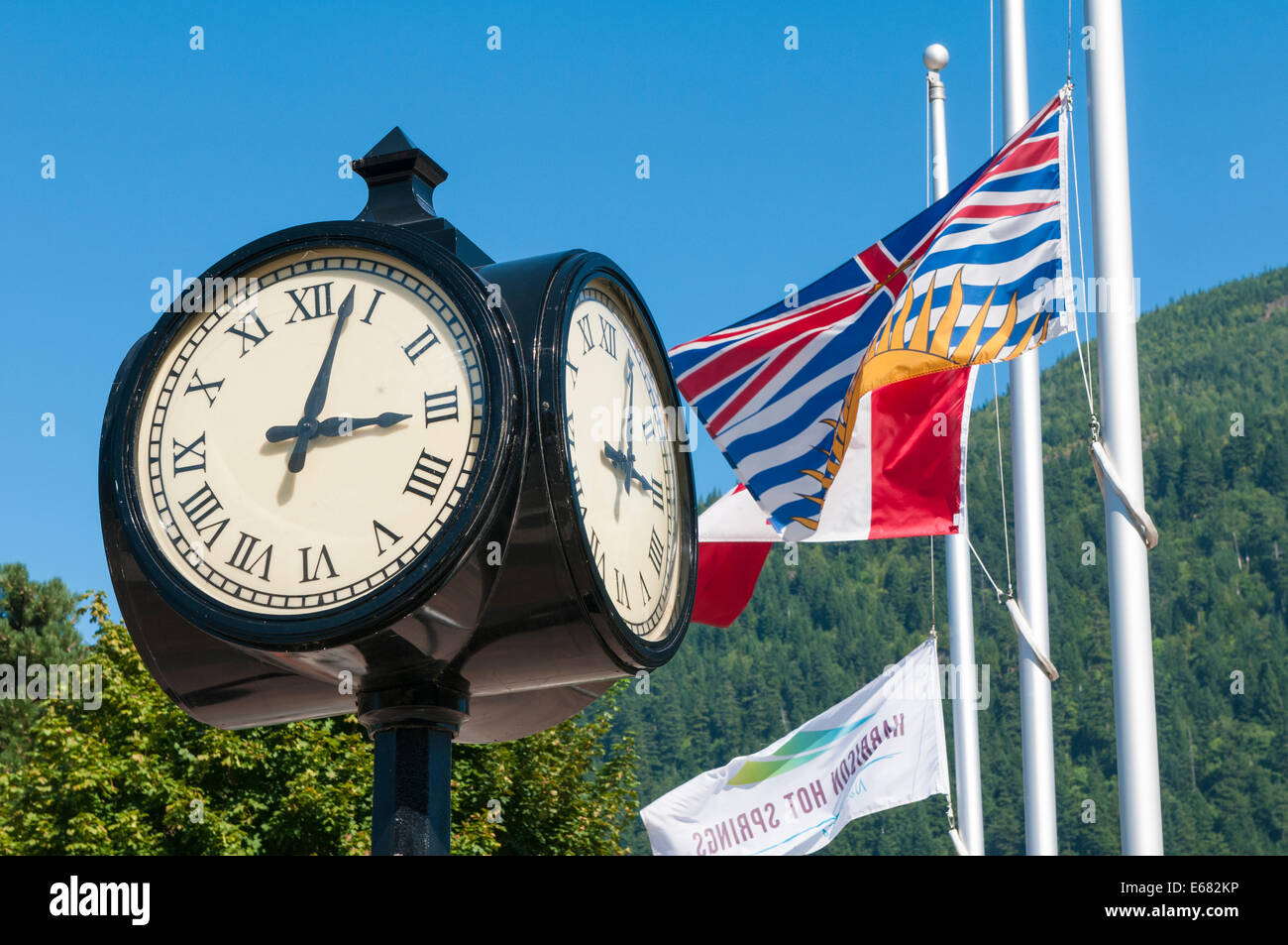 Outdoor clock face and provincial flag in downtown Harrison Hot Springs ...
