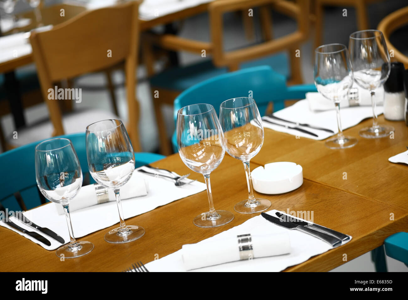 Shot with a dinner table in a restaurant Stock Photo - Alamy