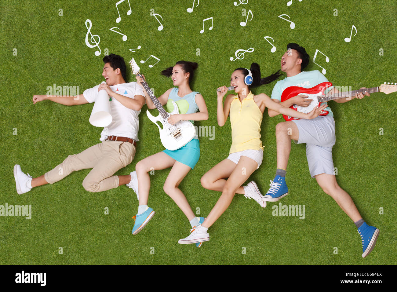 Young people on grass playing musical instruments Stock Photo - Alamy