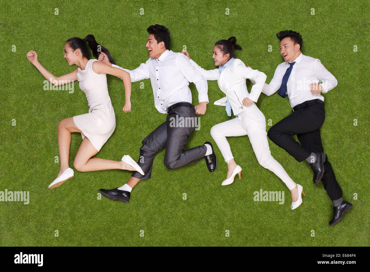 Young people on grass Stock Photo - Alamy