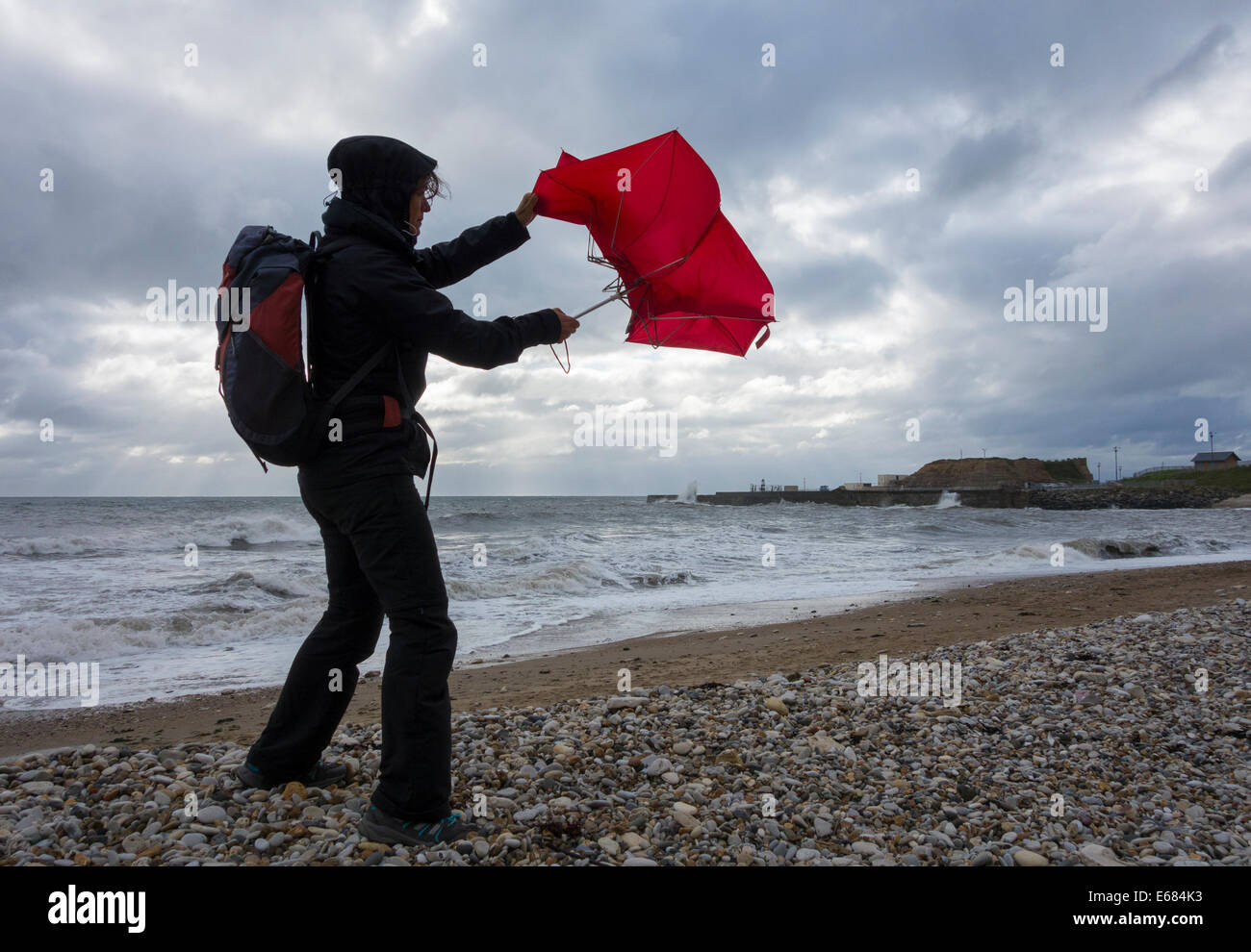 Female walker on the Durham Heritage coastal footpath at Seaham on a ...