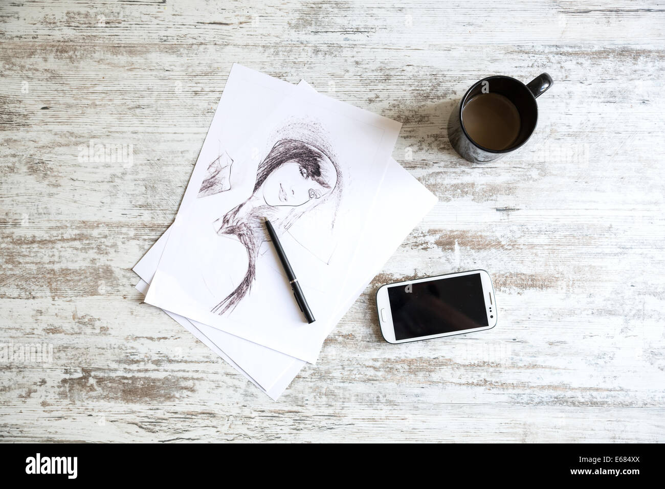 Drawing a sketch on the Table Stock Photo - Alamy