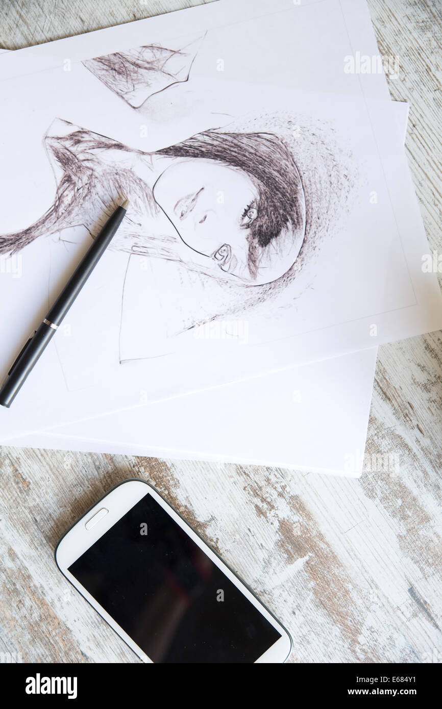 Drawing a sketch on the Table Stock Photo - Alamy