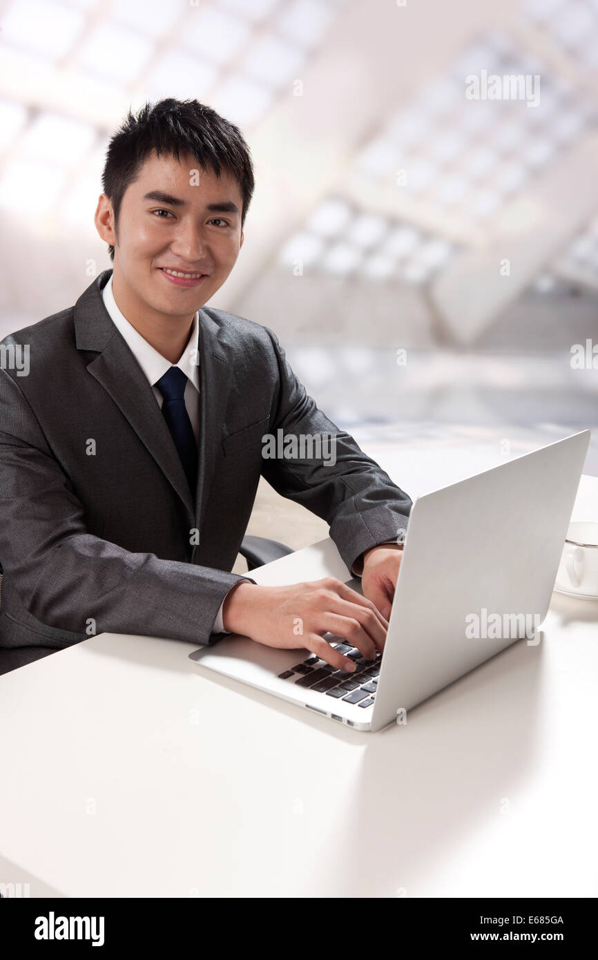 Young businessman using laptop Stock Photo - Alamy Young businessman using laptop Stock Photo - Alamy