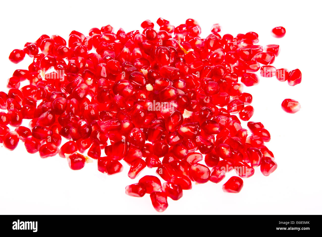 Pomegranate fruit seeds on white background Stock Photo - Alamy