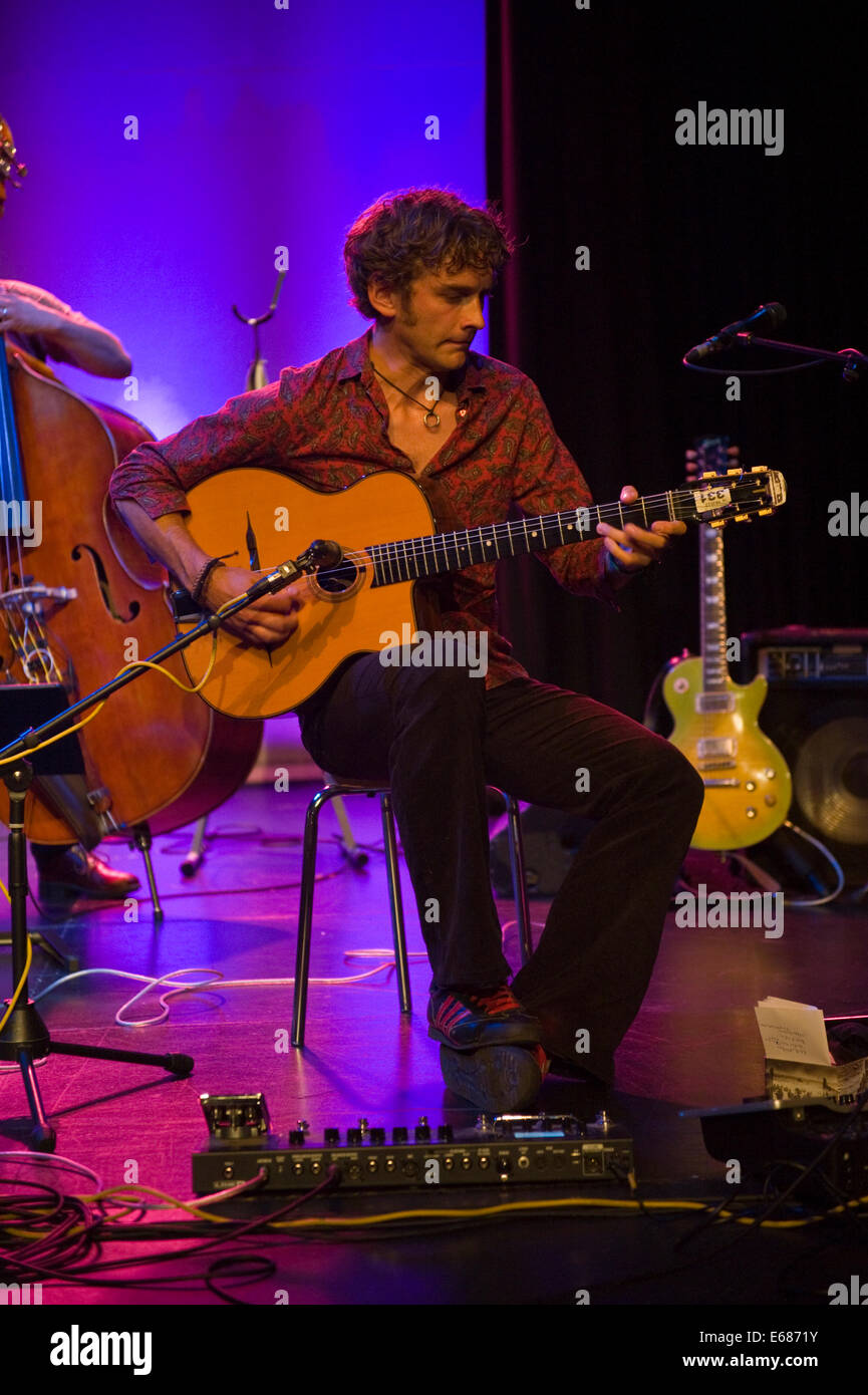 Live music guitarist with Remi Harris Gypsy Jazz Project band on stage ...