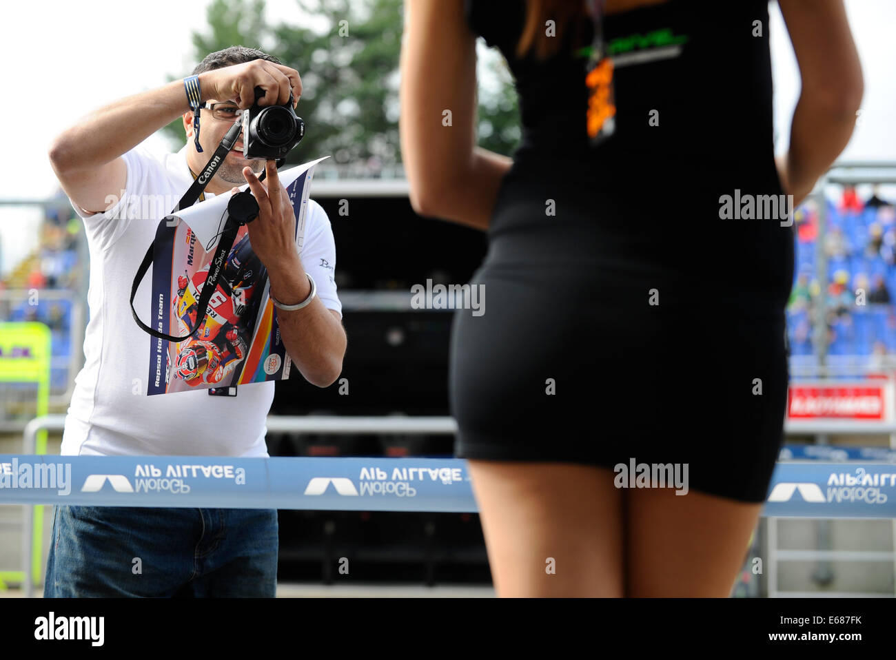 The hostess is photographed during motorcycle Grand Prix race at the ...
