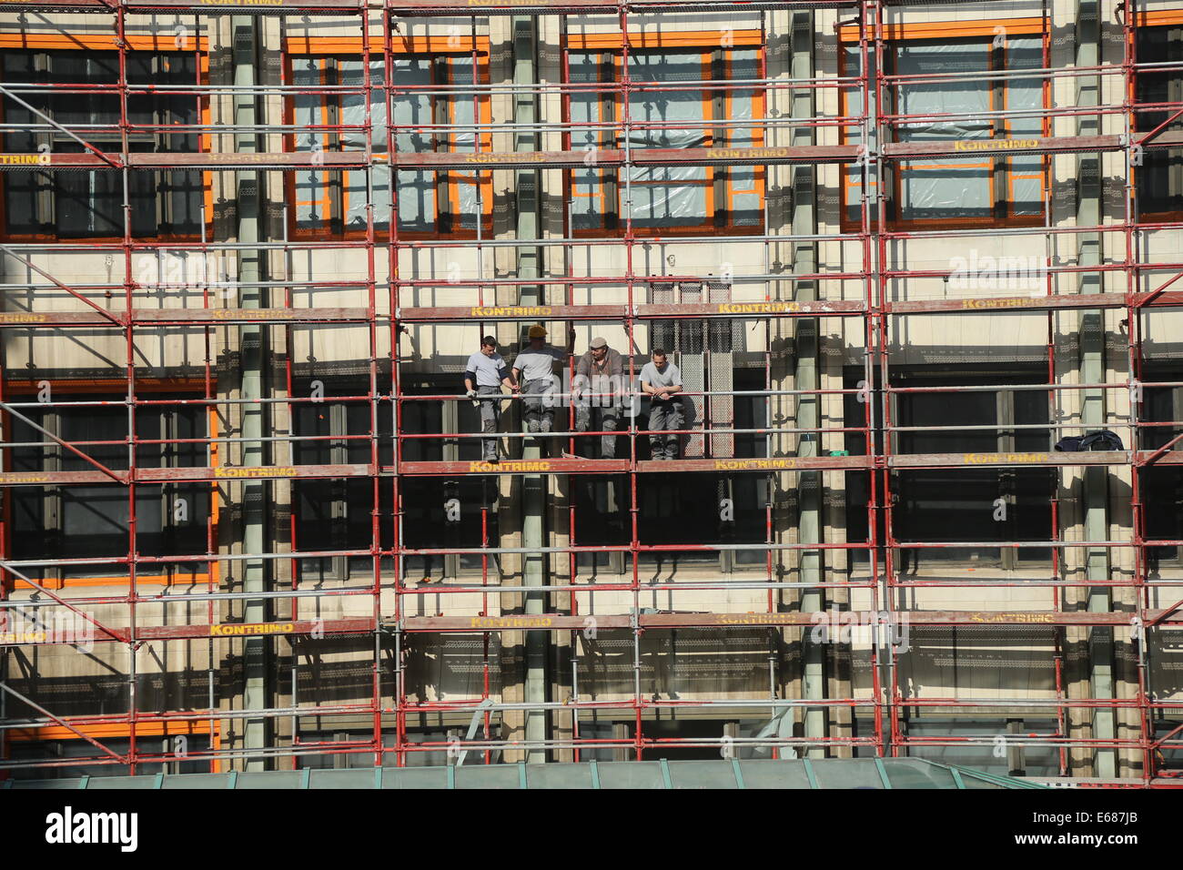 Men at work on scaffolding in Brussels. Construction site Stock Photo ...