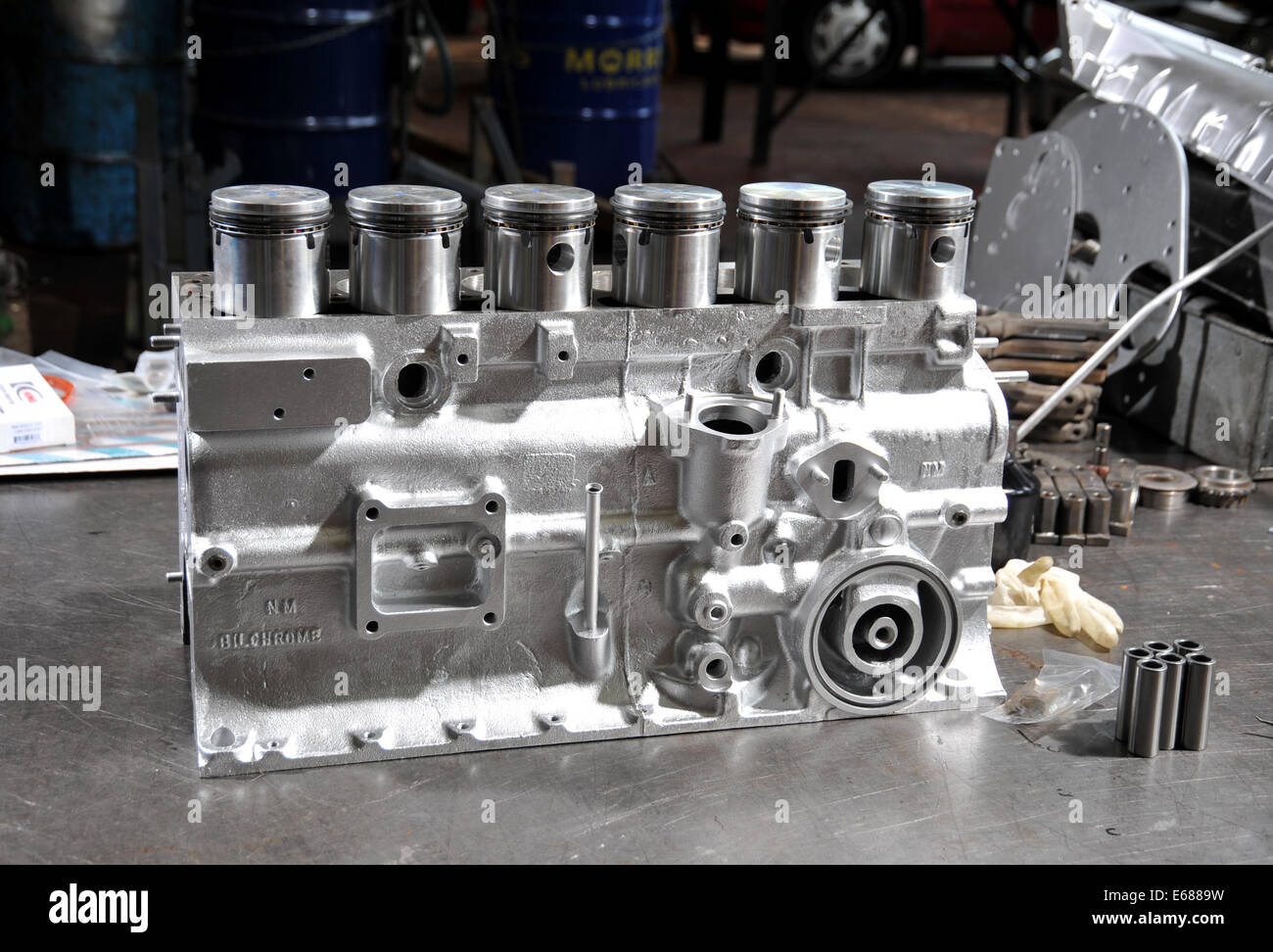 Triumph straight 6 engine, partly assembled with pistons exposed and no ...