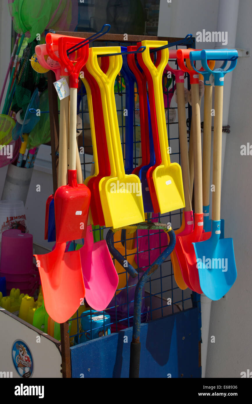 Coloured beach sand spades on sale Freshwater Bay Isle of Wight UK ...