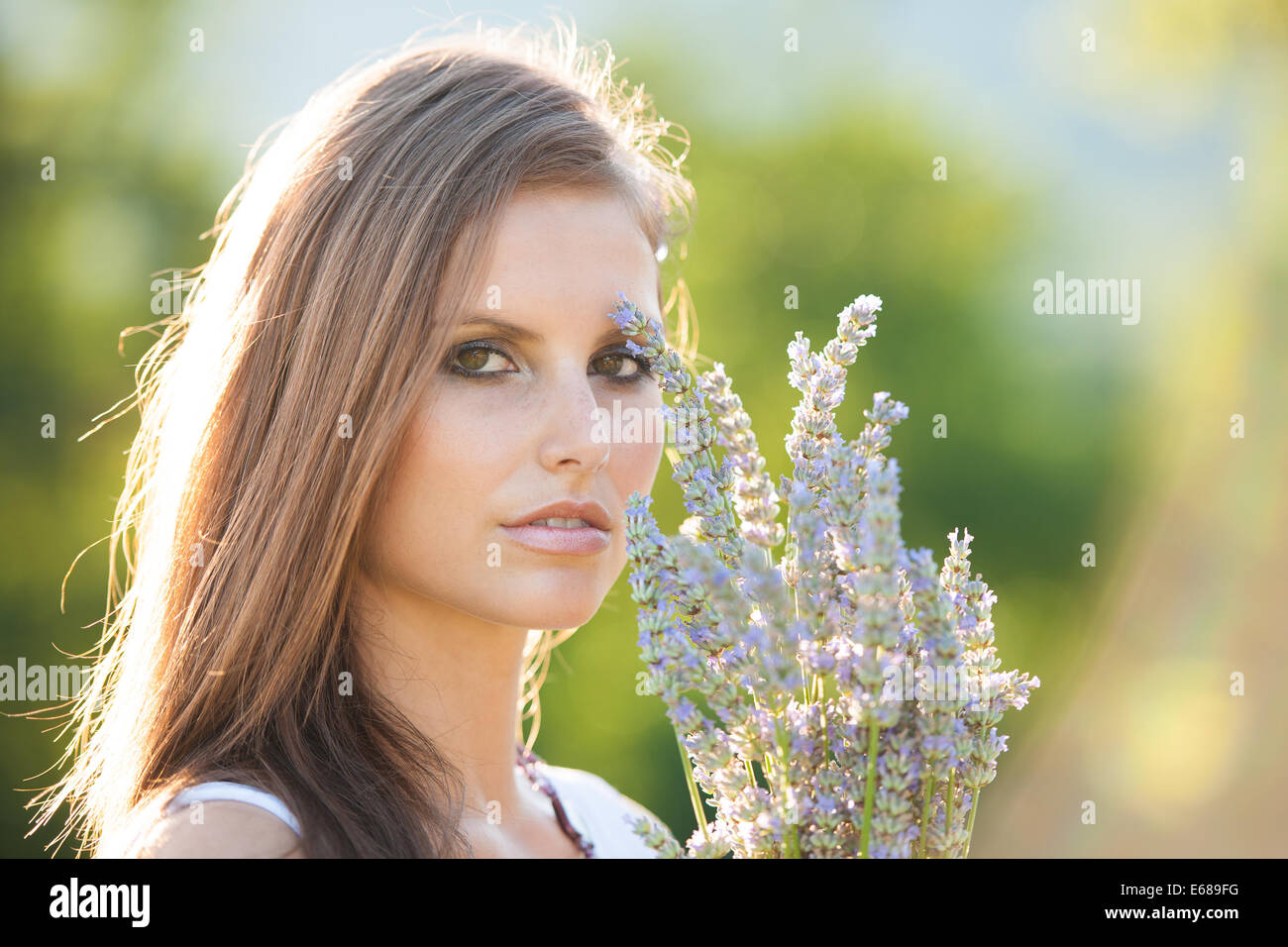 Beautiful young woman on lavender field - lavanda girl in early summer ...