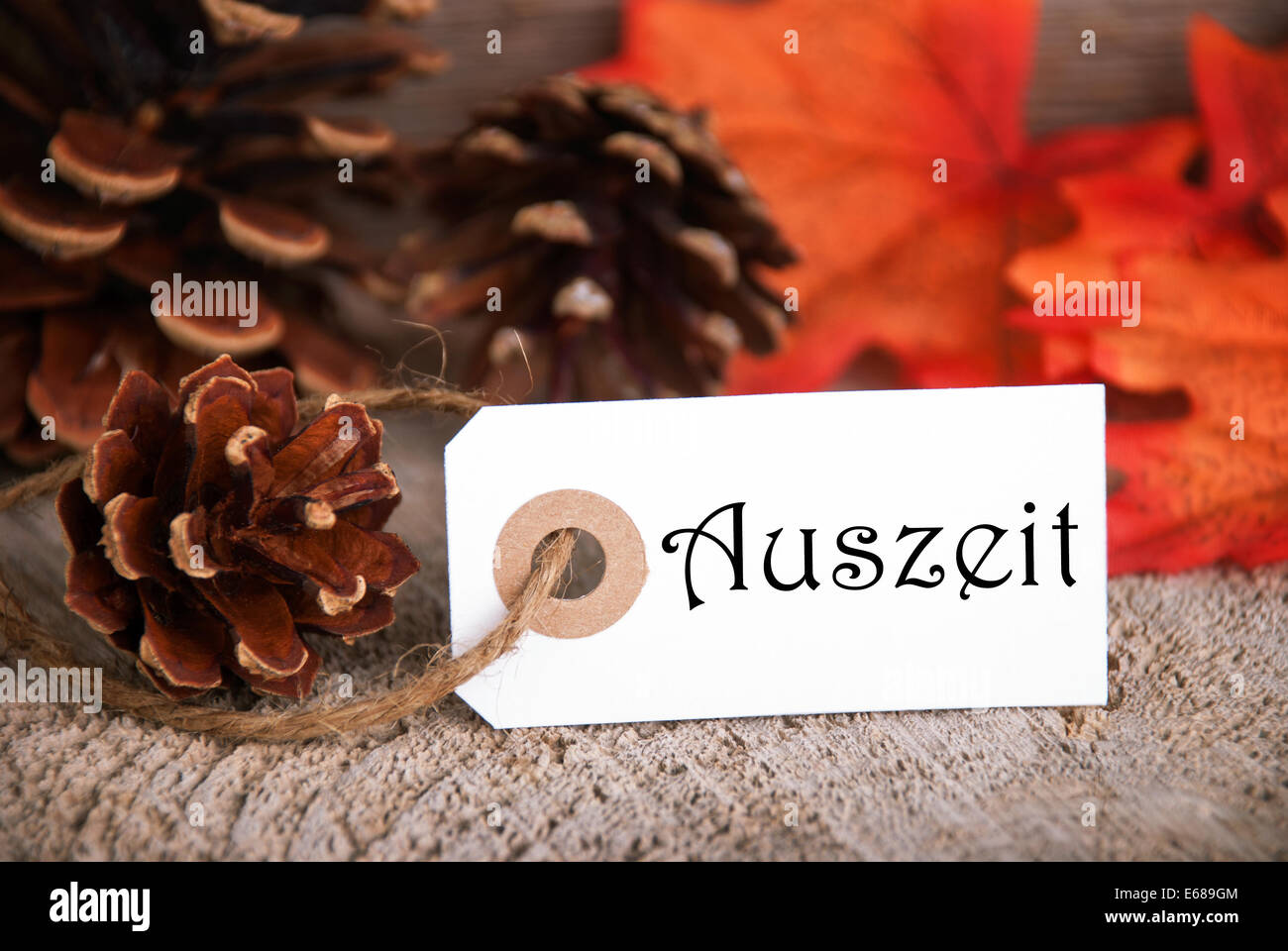 An Autumnal Label with the German Word Auszeit which means Downtime on ...